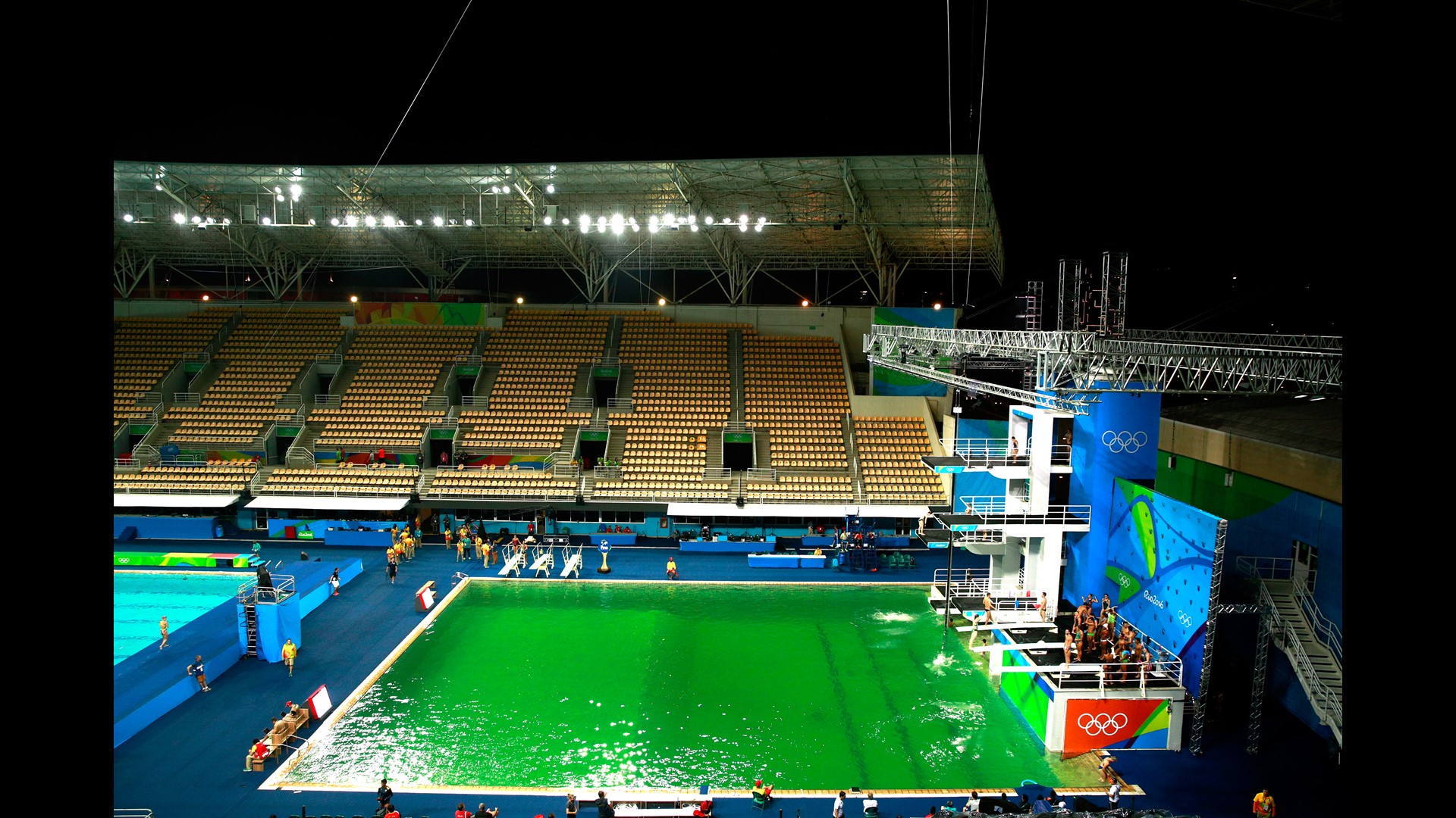 PHOTOS | Olympic diving pool turns bright green | kiiitv.com
